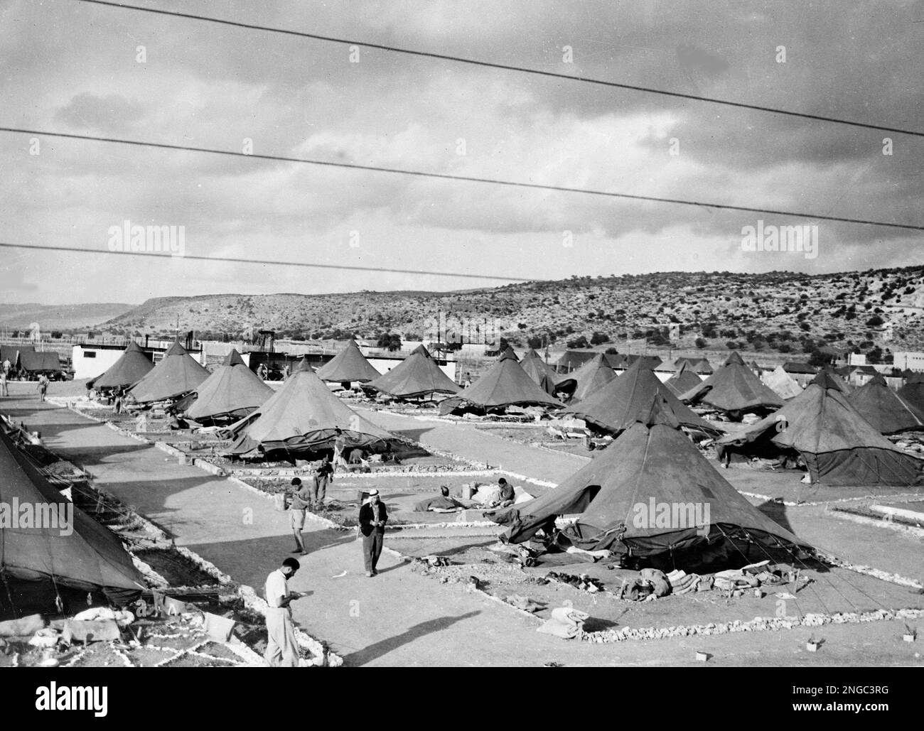 Prisoners of the Israeli army stroll around their camp during their ...