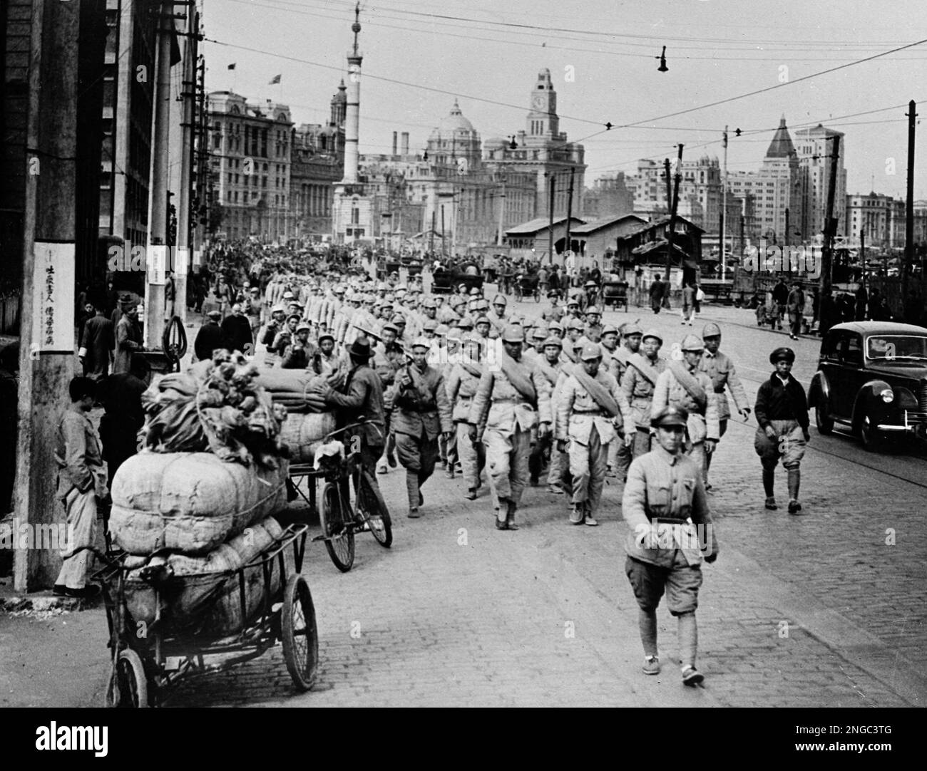 A division of Nationalist Chinese soldiers march in the Bund, Shanghai ...