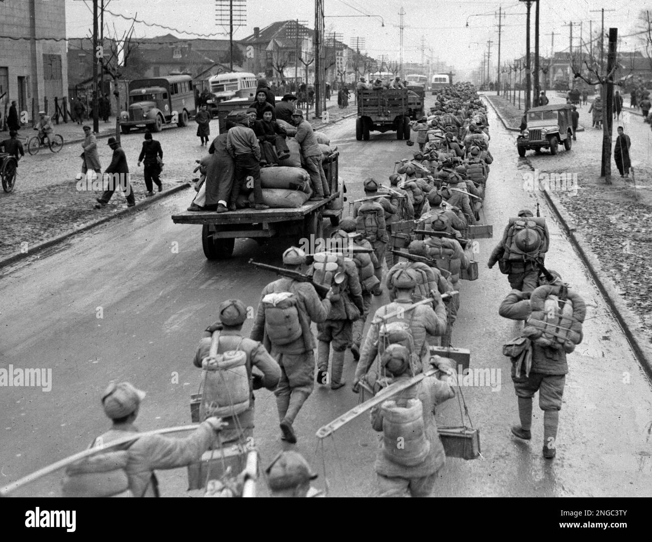 Chinese Nationalist troops march through the outskirts of Nanking ...