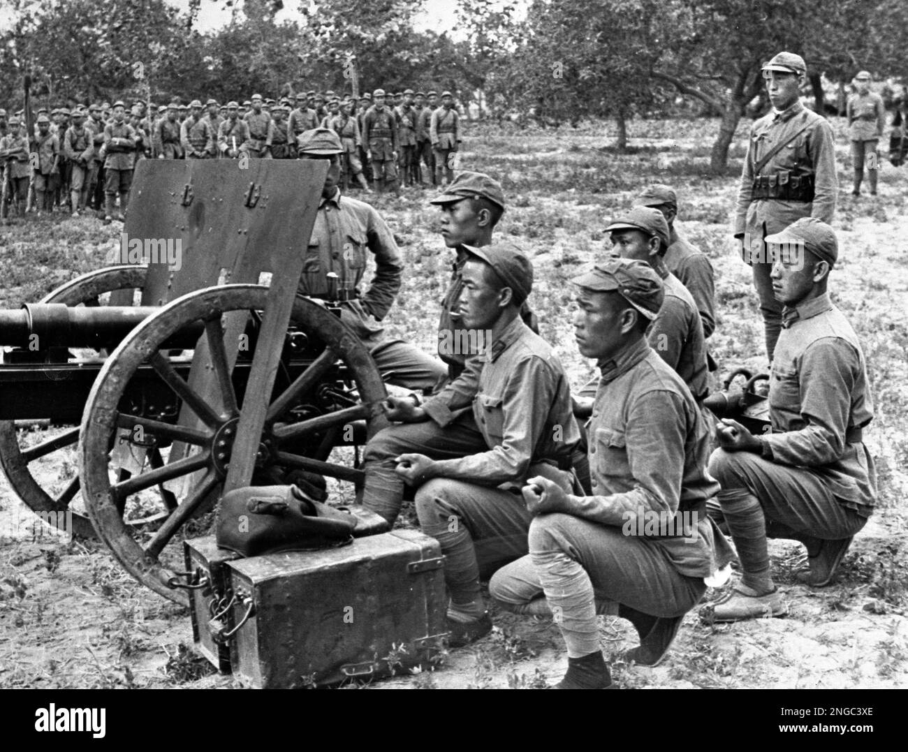 Chinese Communist gunners, in northern China, practice with their gun ...