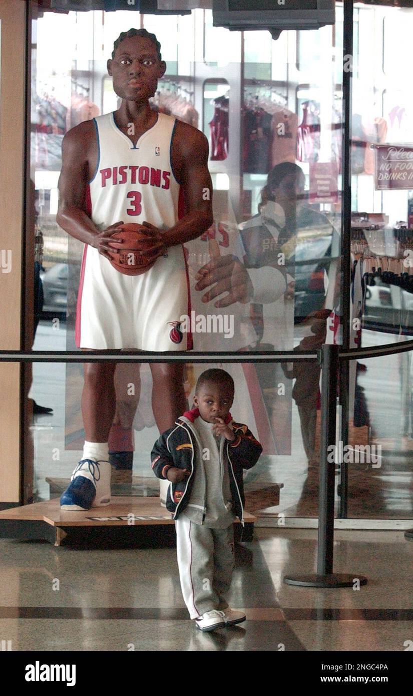 Bryce Wallace, 2, son of Detroit Pistons center Ben Wallace, looks back ...