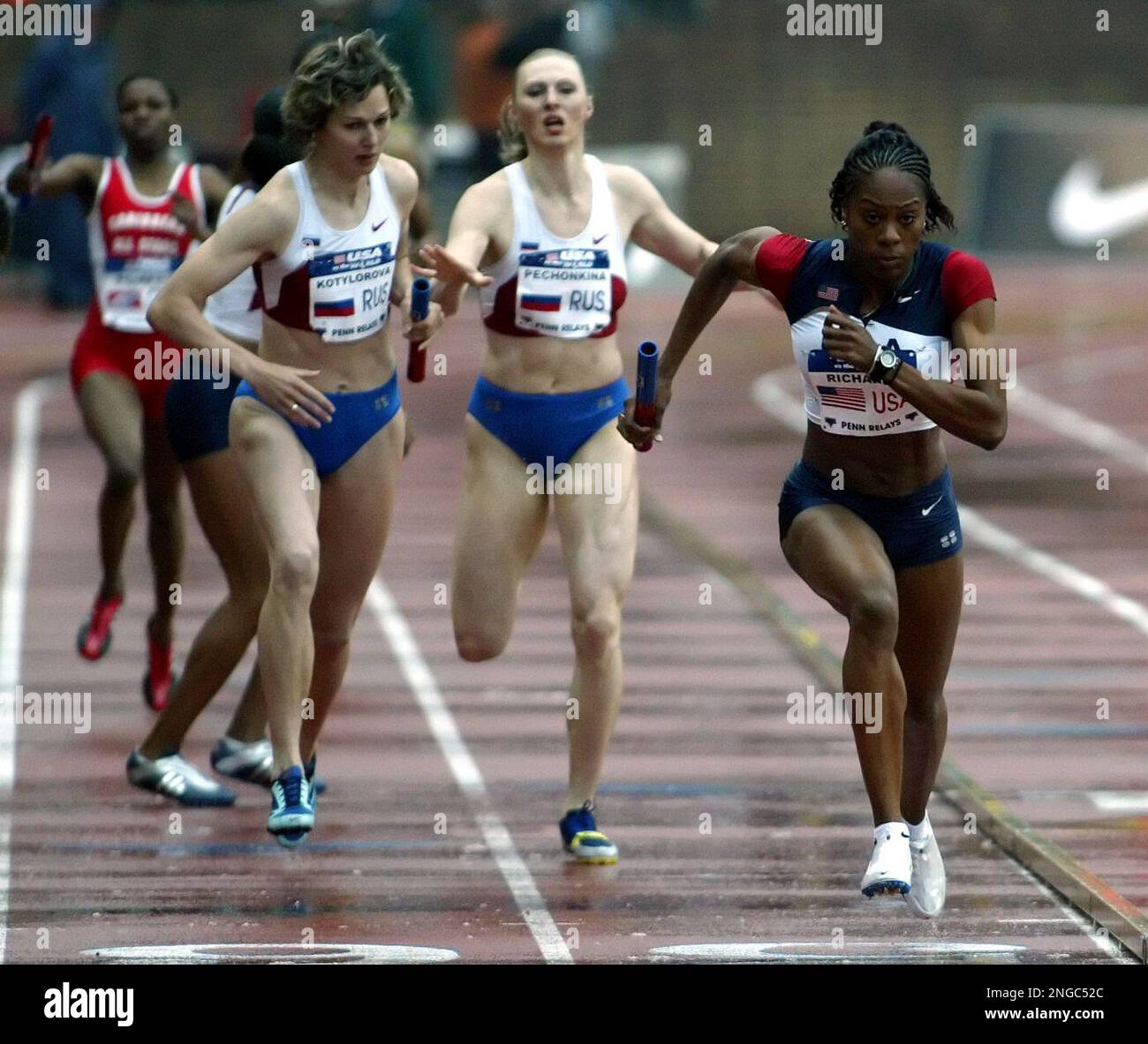 United State's Sandie Richards, right, runs the fourth leg of the women ...