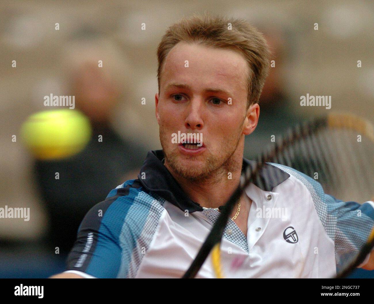 Christophe Rochus of Belgium returns a backhand to Gaston Gaudio of ...