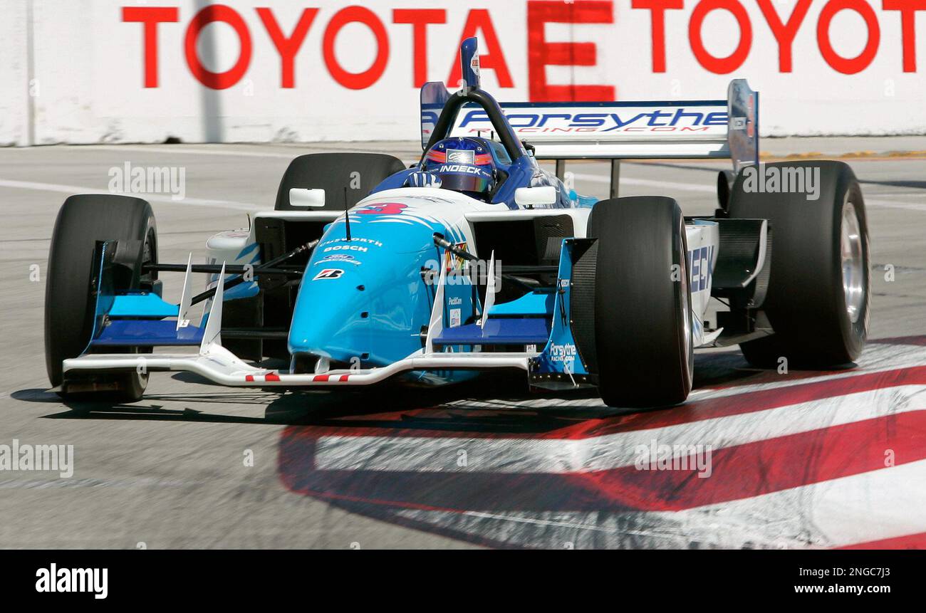 Paul Tracy goes through turn one during the first day of qualifying for ...