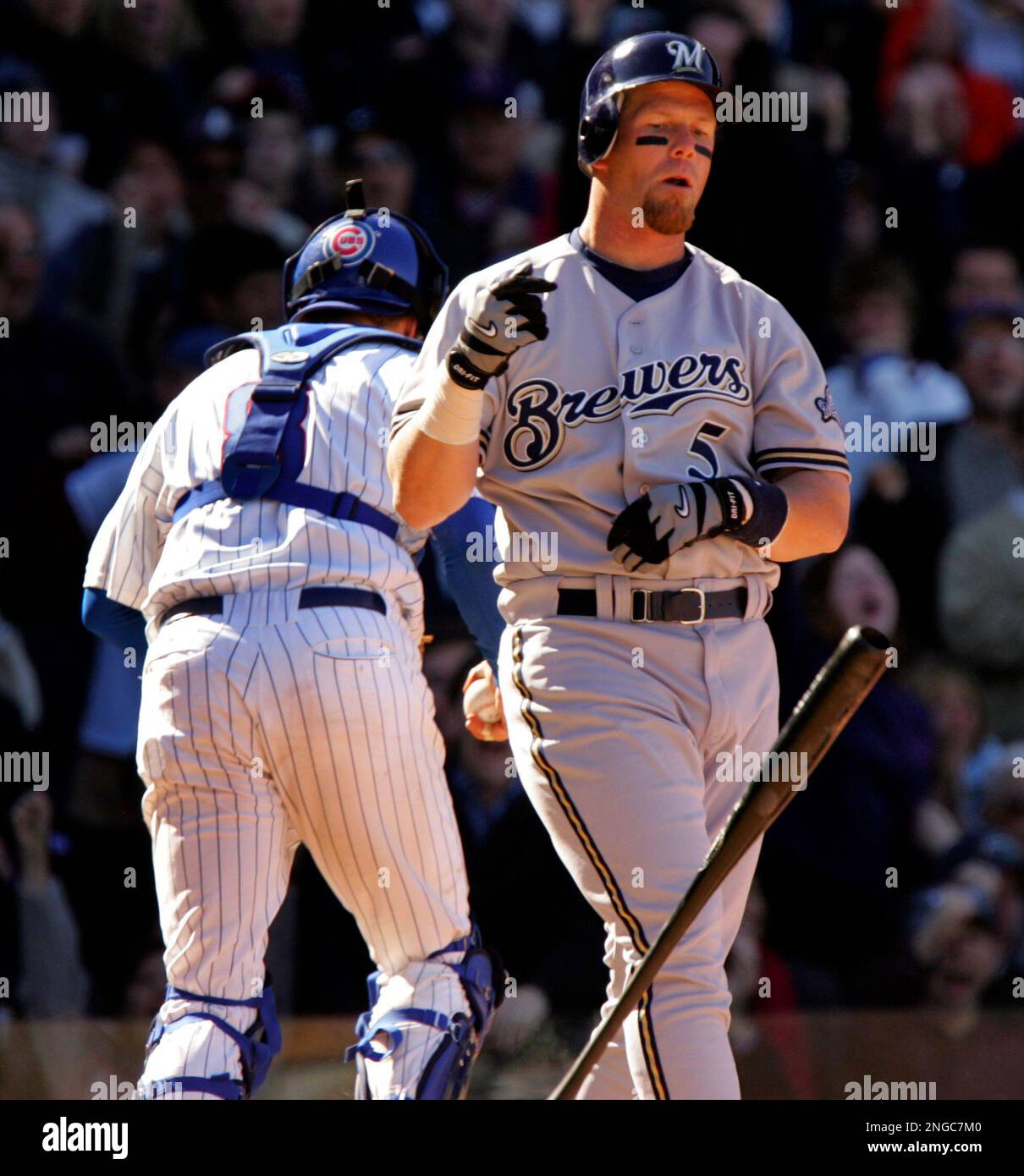 Milwaukee Brewers' Geoff Jenkins, right, throws his bat after striking ...