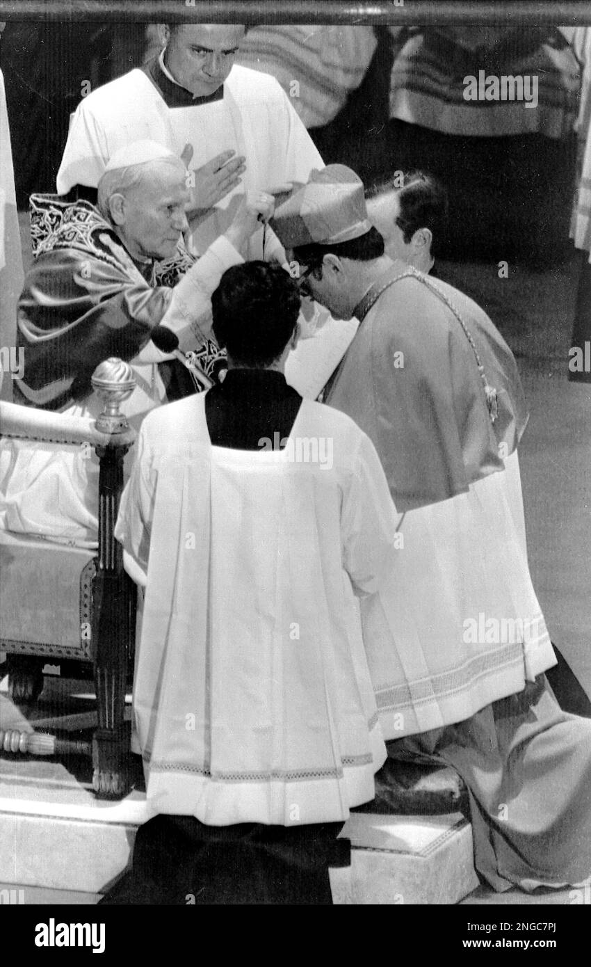 Pope John Paul II bestows the biretta on Joachim Meisner, Archbishop of ...