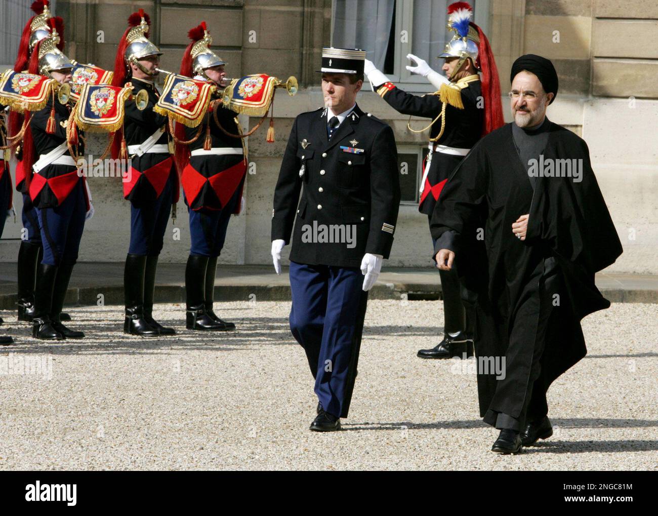 Iranian President Mohammad Khatami reviews an honour guard upon his ...