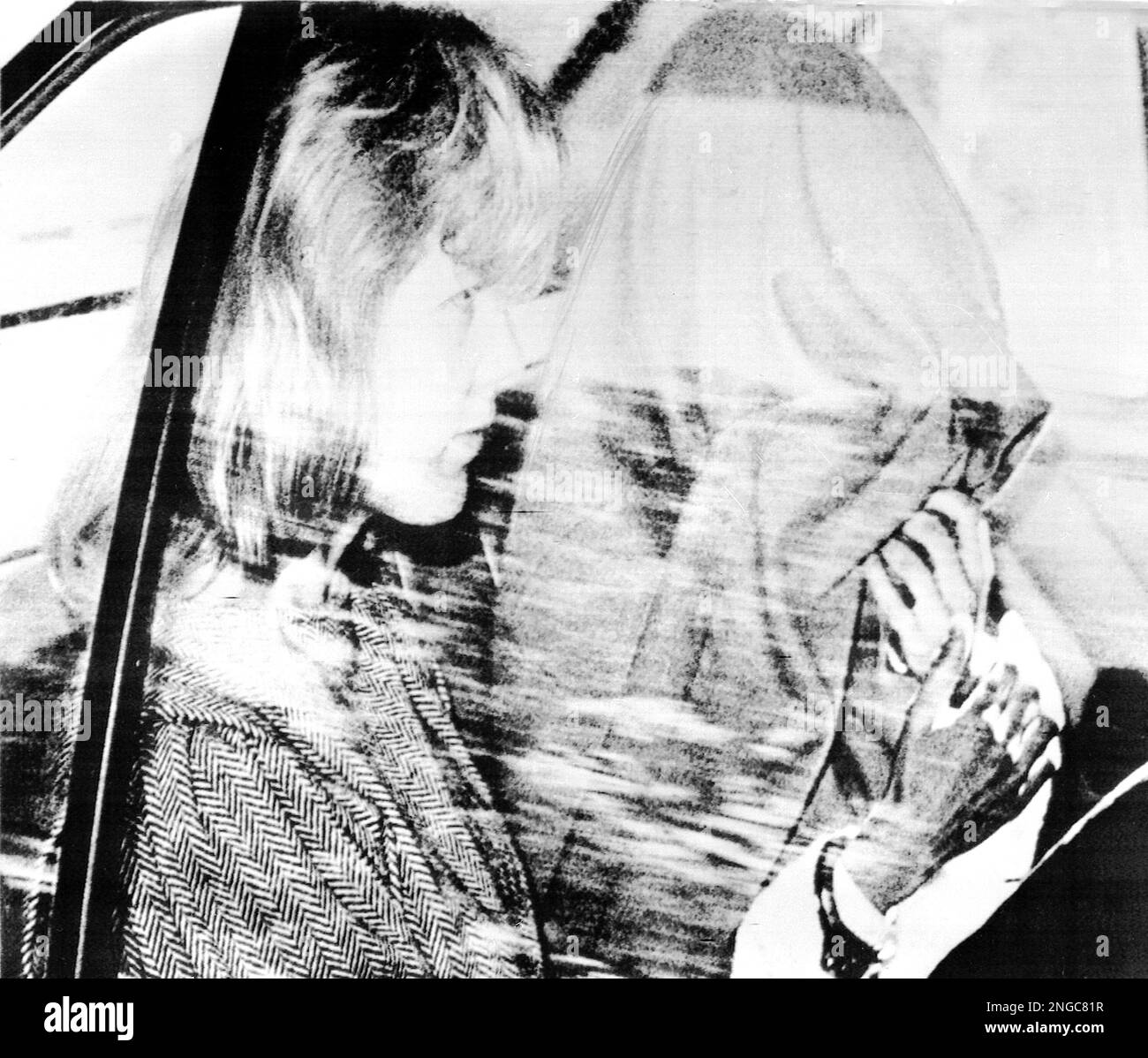 Head covered with a blanket and handcuffed Major Alain Mafart alias ...