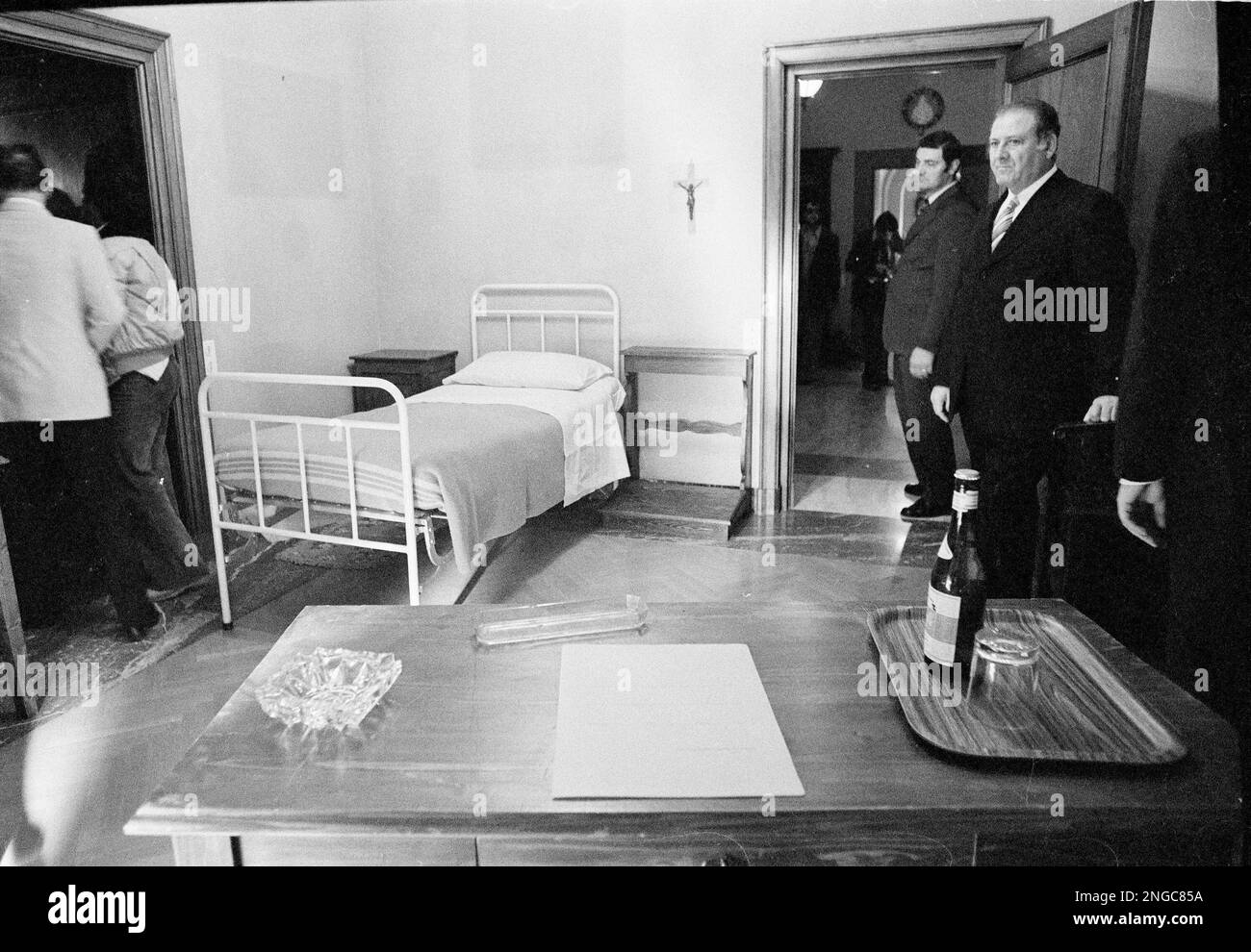 Reporters stand in one of the cells where the Cardinals will sleep ...