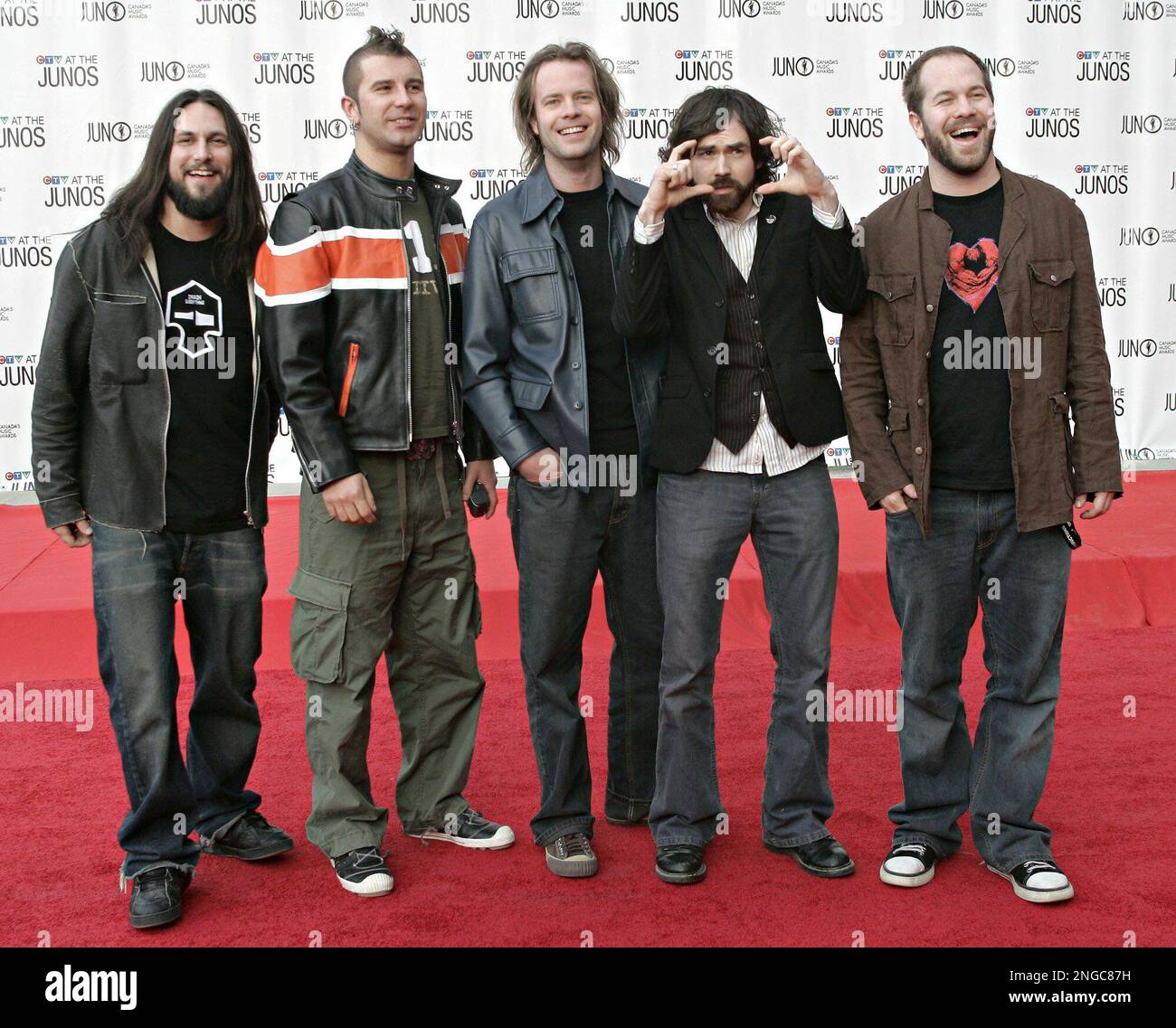 Members of Finger Eleven joke with photographers as they pose on the ...