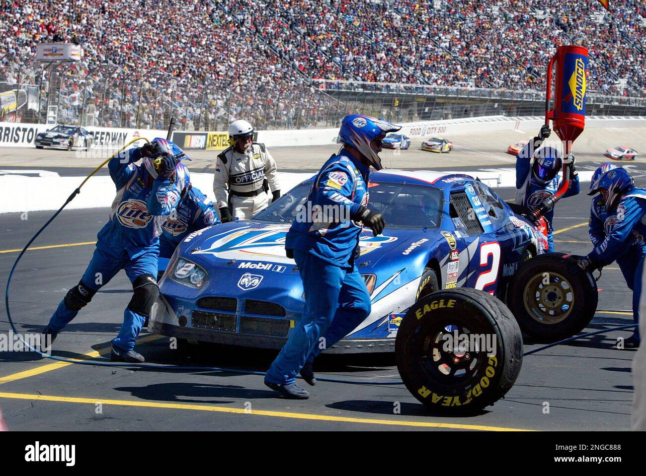 Crew members work on Rusty Wallace's car during a pit stop at the ...