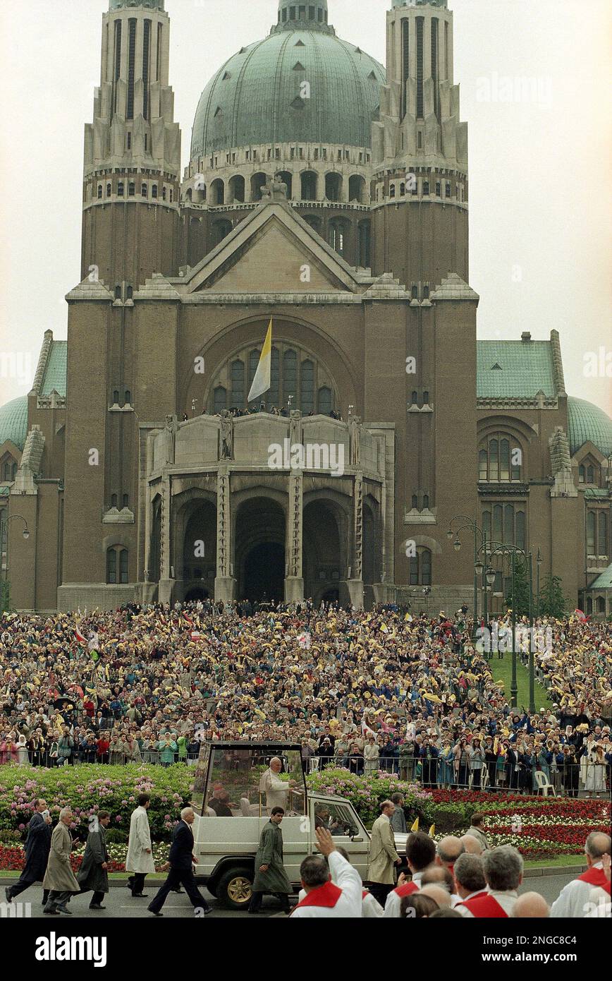 Pope John Paul II is cheered as he passes the Basilica of Koekelberg in ...