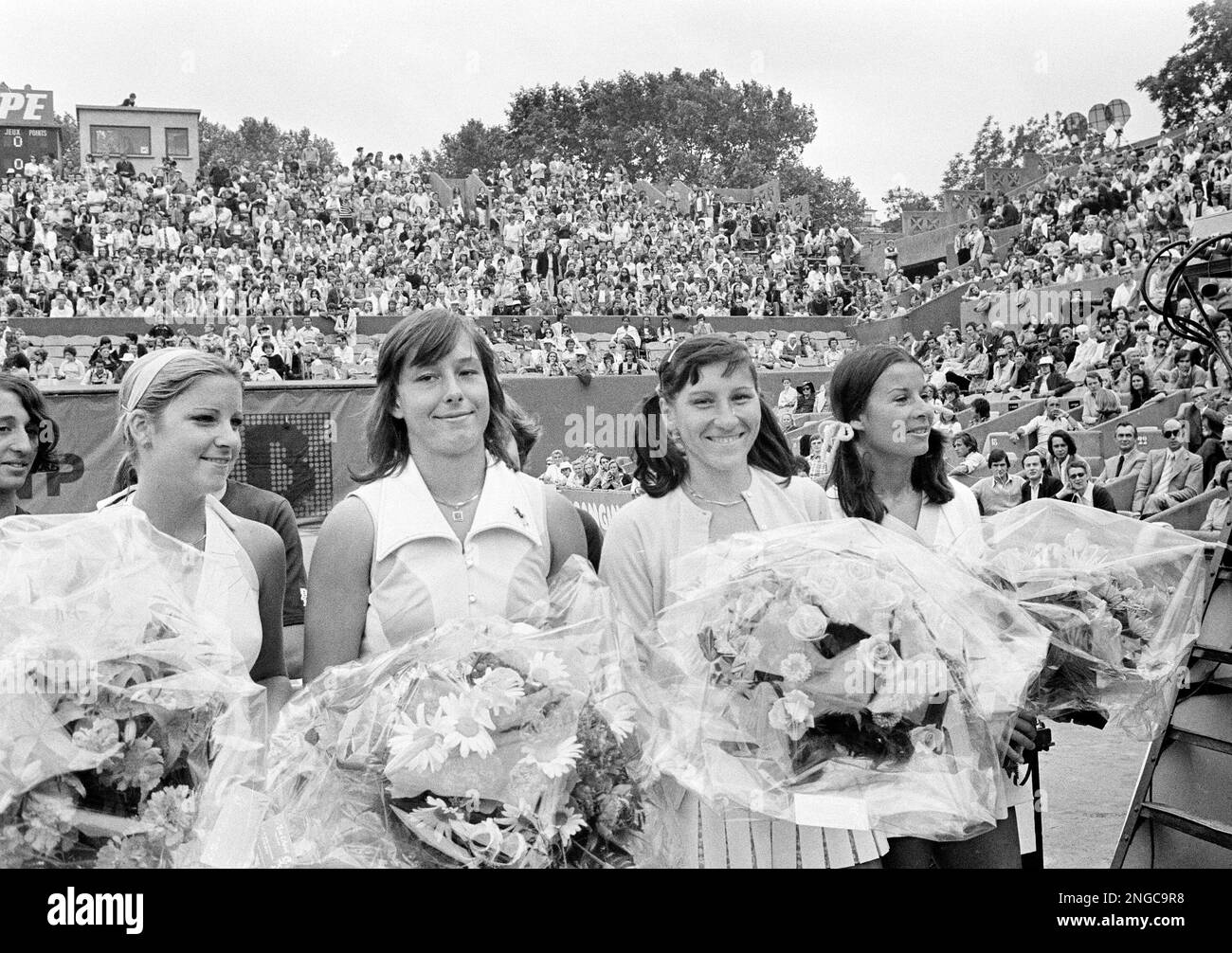 Presented with flowers are Chris Evert of Fort Lauderdale, Fla., left ...