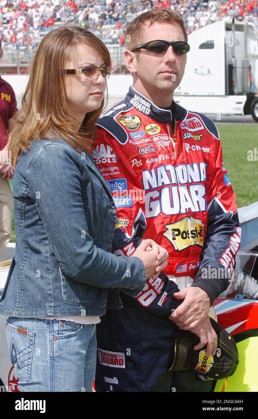 Driver Greg Biffle waits with girlfriend, Nicole Lunders, on pit row ...