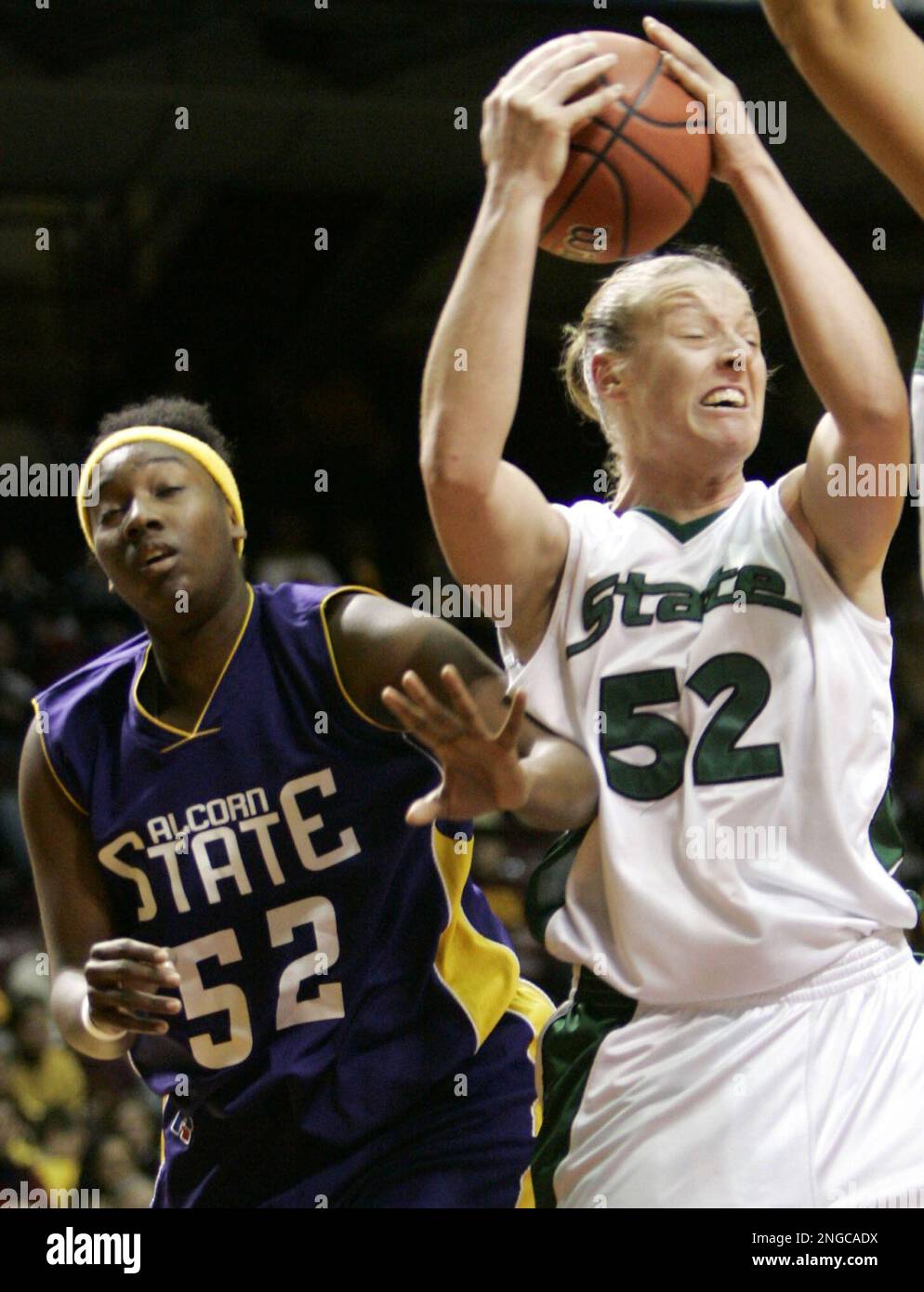 Michigan State forward Liz Shimek, right, pulls down a rebound over ...