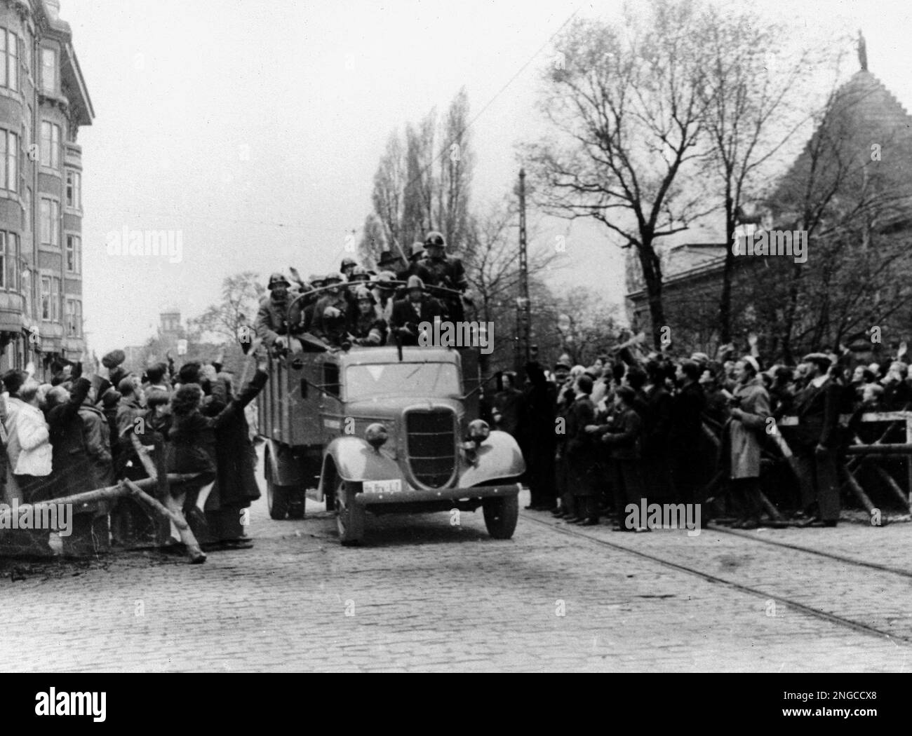 A truck carrying Danish police officers passes through a barrier of ...