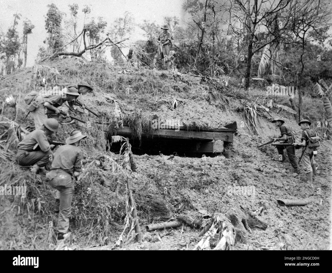 Soldiers of the Australian Imperial Forces Division discover a Japanese ...