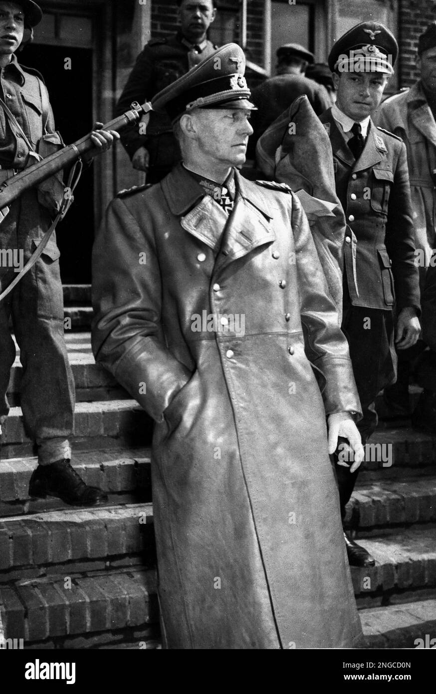 Germany's Gen. Alfred Jodl is escorted down the steps of the ...