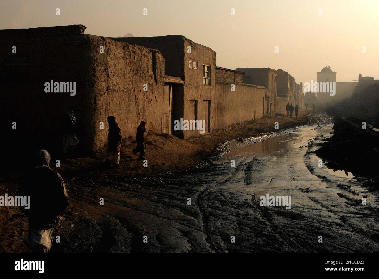 People walk in the Bagh-e-Ali Mardan's neighborhood in Kabul ...