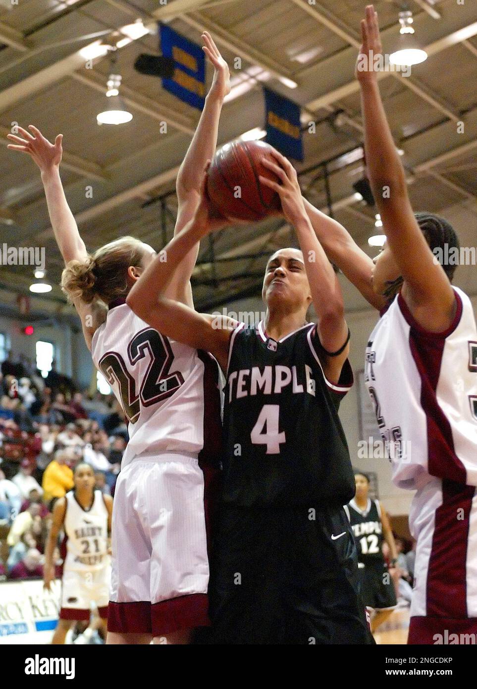 Temple's Candice Dupree (4) goes between Saint Joseph's defenders Faith ...