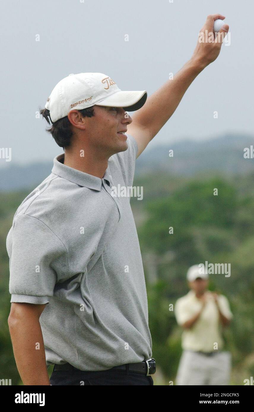 Kevin Haefner holds up his ball on the 18th hole during the 'Tour de ...