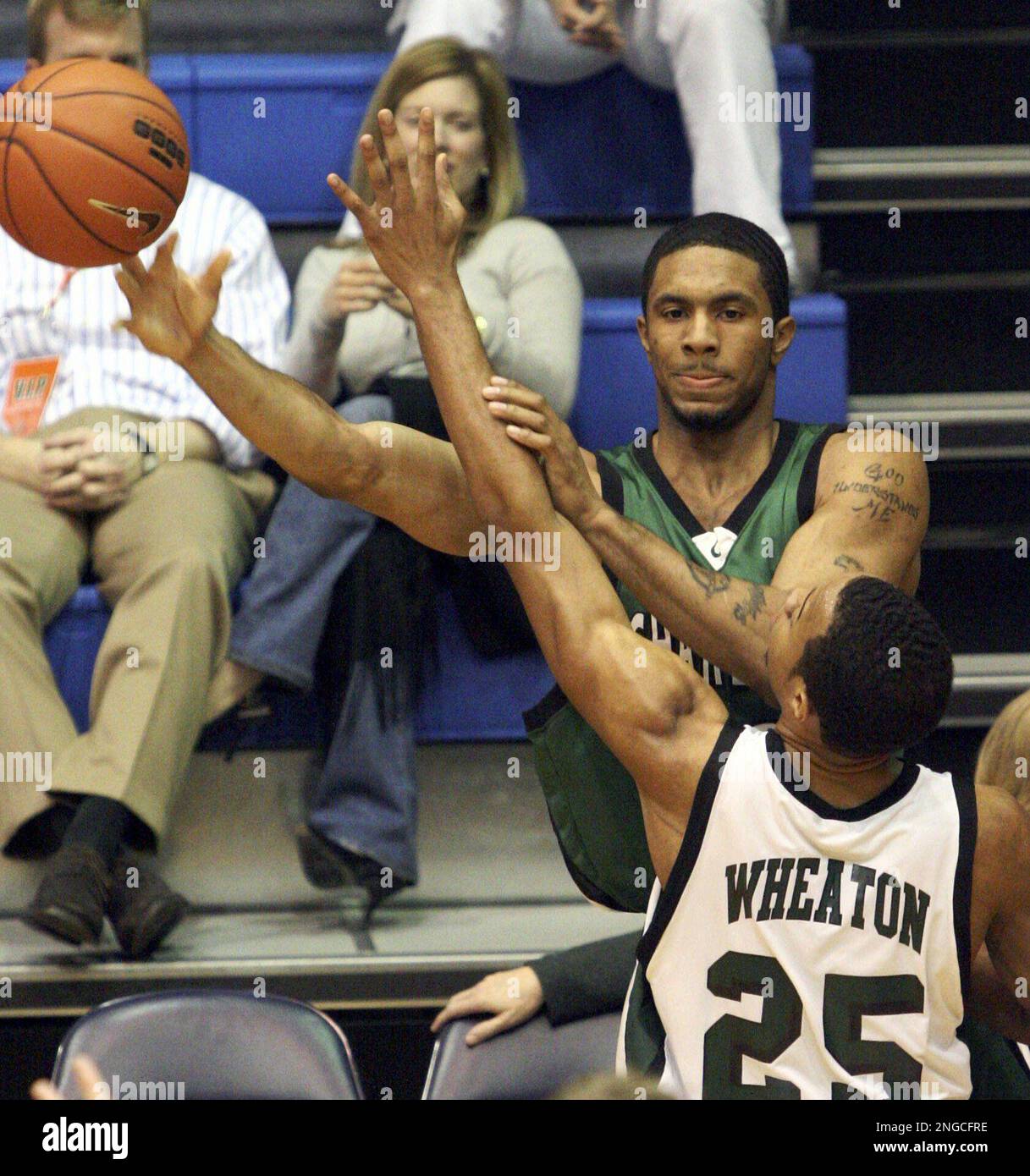 Charlotte's Eddie Basden (13) passes around Tulane's Matt Wheaton (25 ...