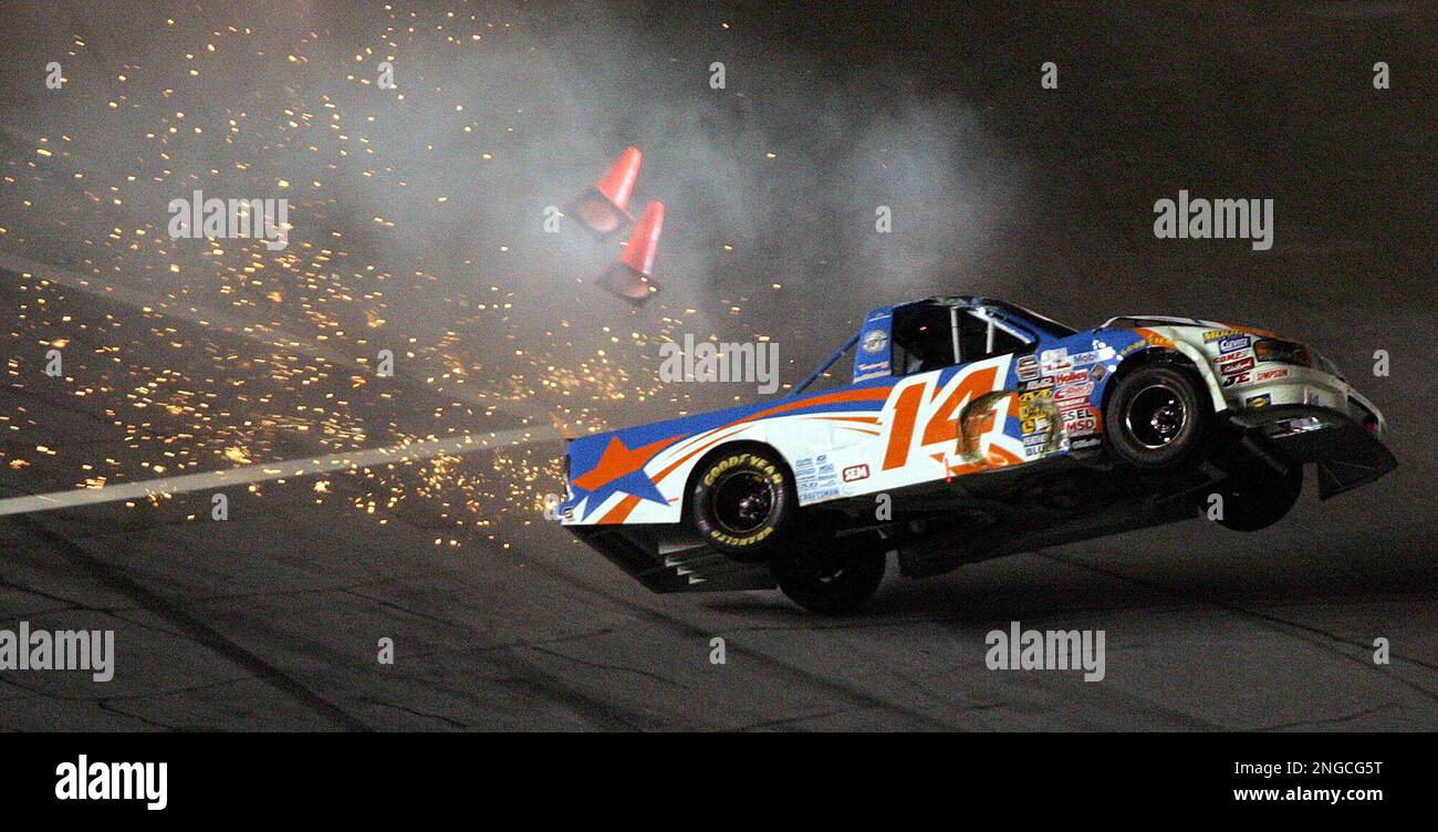 NASCAR Craftsman truck driver Rick Crawford leaves a trail of sparks ...