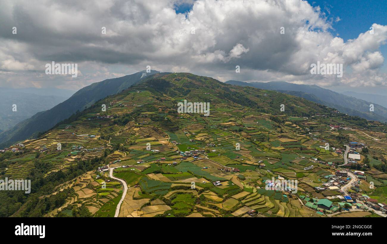 Rice terraces and agricultural land on hillsides in a mountainous ...