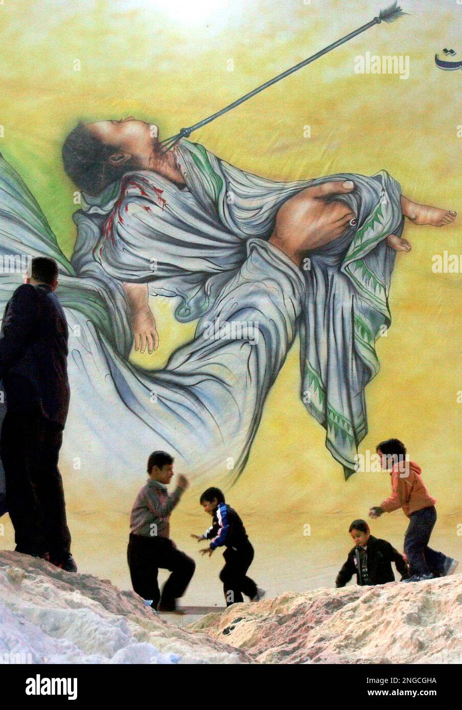 Children play at night beneath a mural illustrating the death of Imam ...