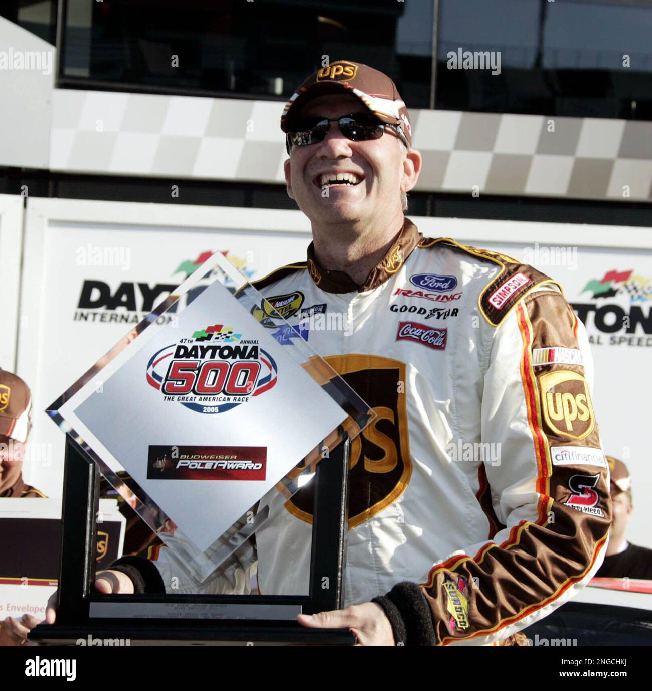 Dale Jarrett holds the trophy in victory lane Sunday, Feb. 13, 2005 ...