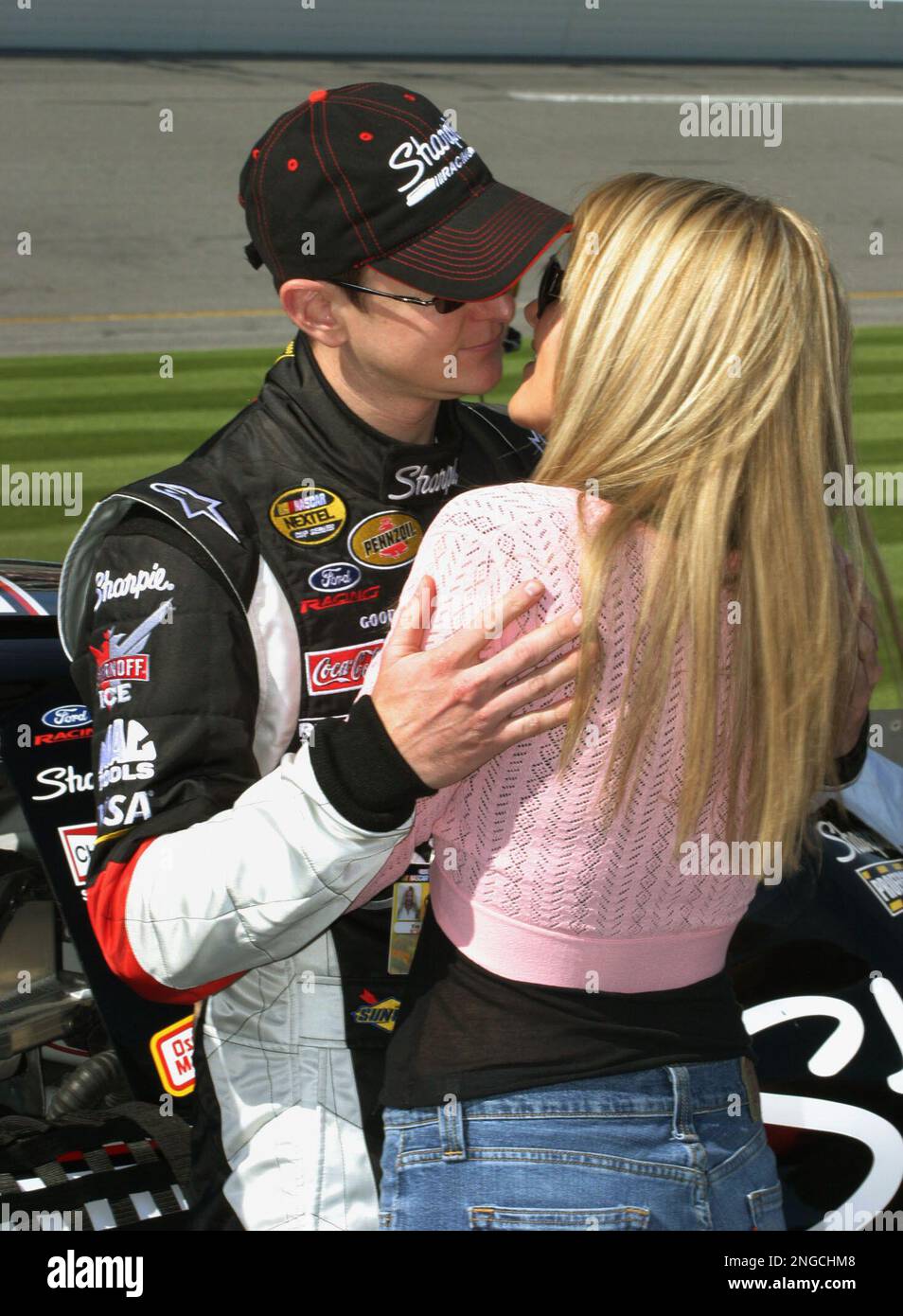 Kurt Busch kisses his girlfriend Eva Bryan as he waits to qualify for ...