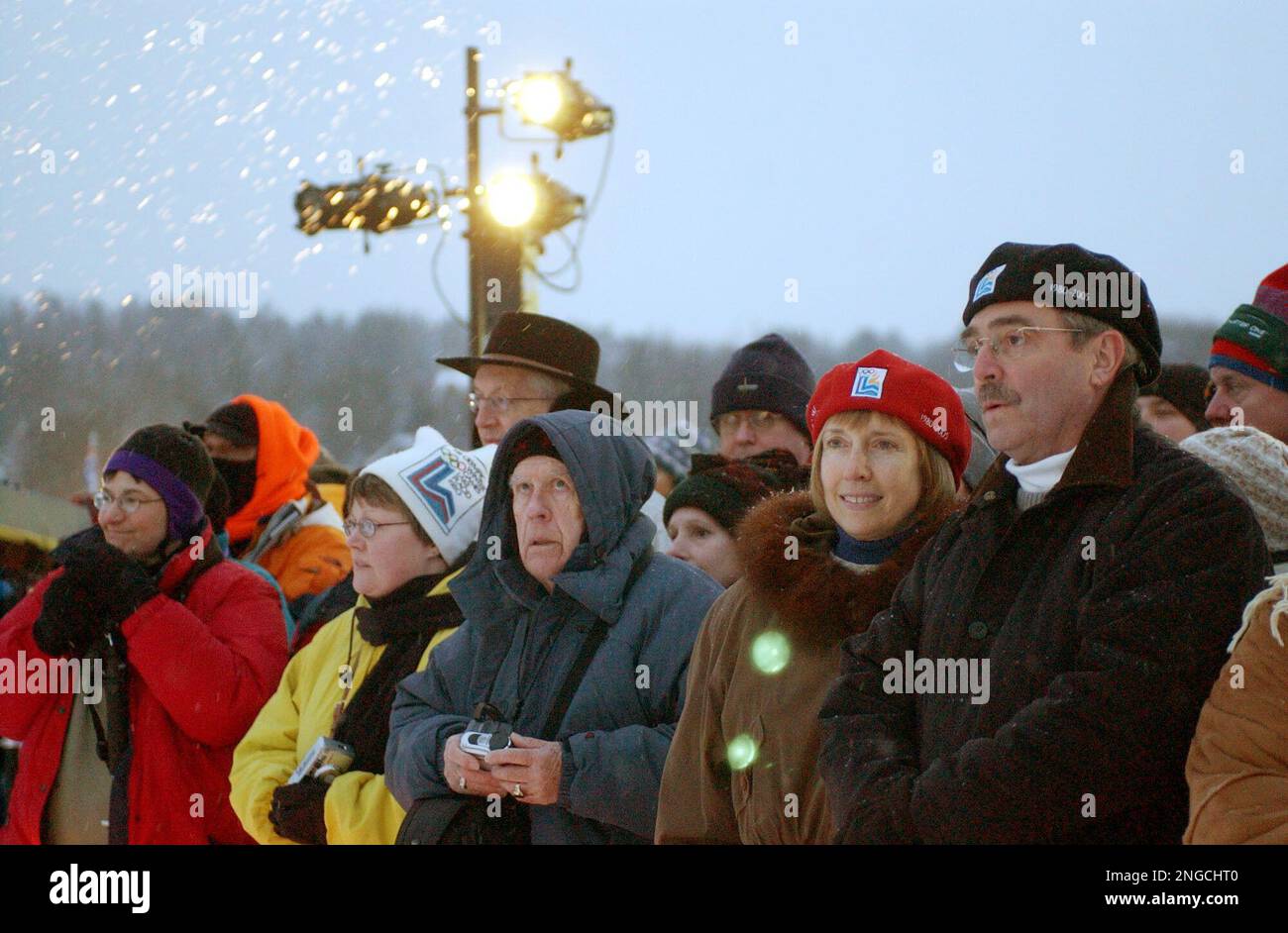 Liz Garger, second from right, and Christian Dewailly, right, watch the ...