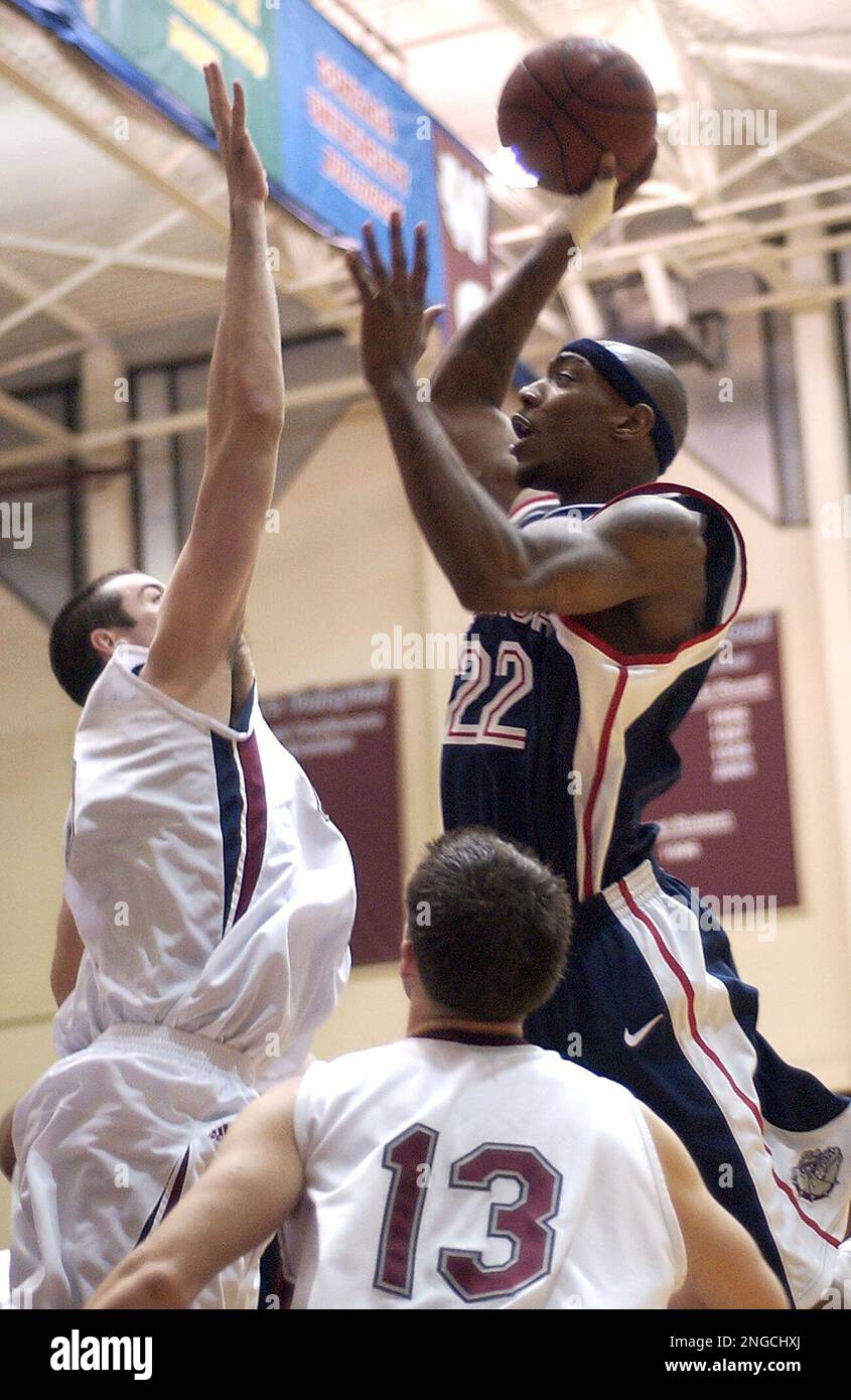 Gonzaga's Erroll Knight, right, shoots over Loyola Marymount's Chris ...