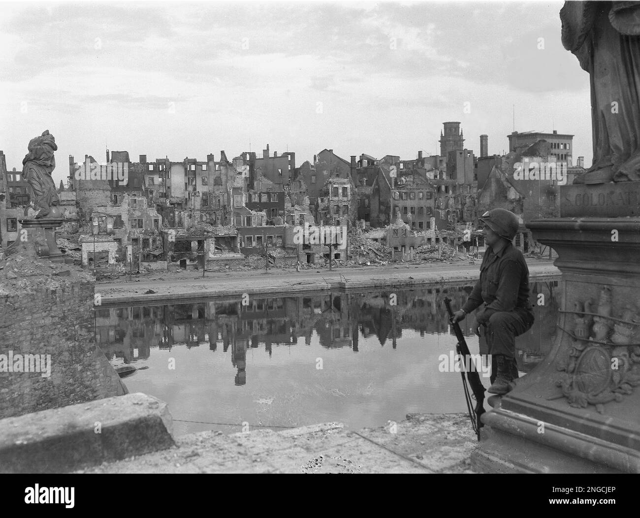 A U.S. soldier stands guard at a bridge on the river Main, leading to ...