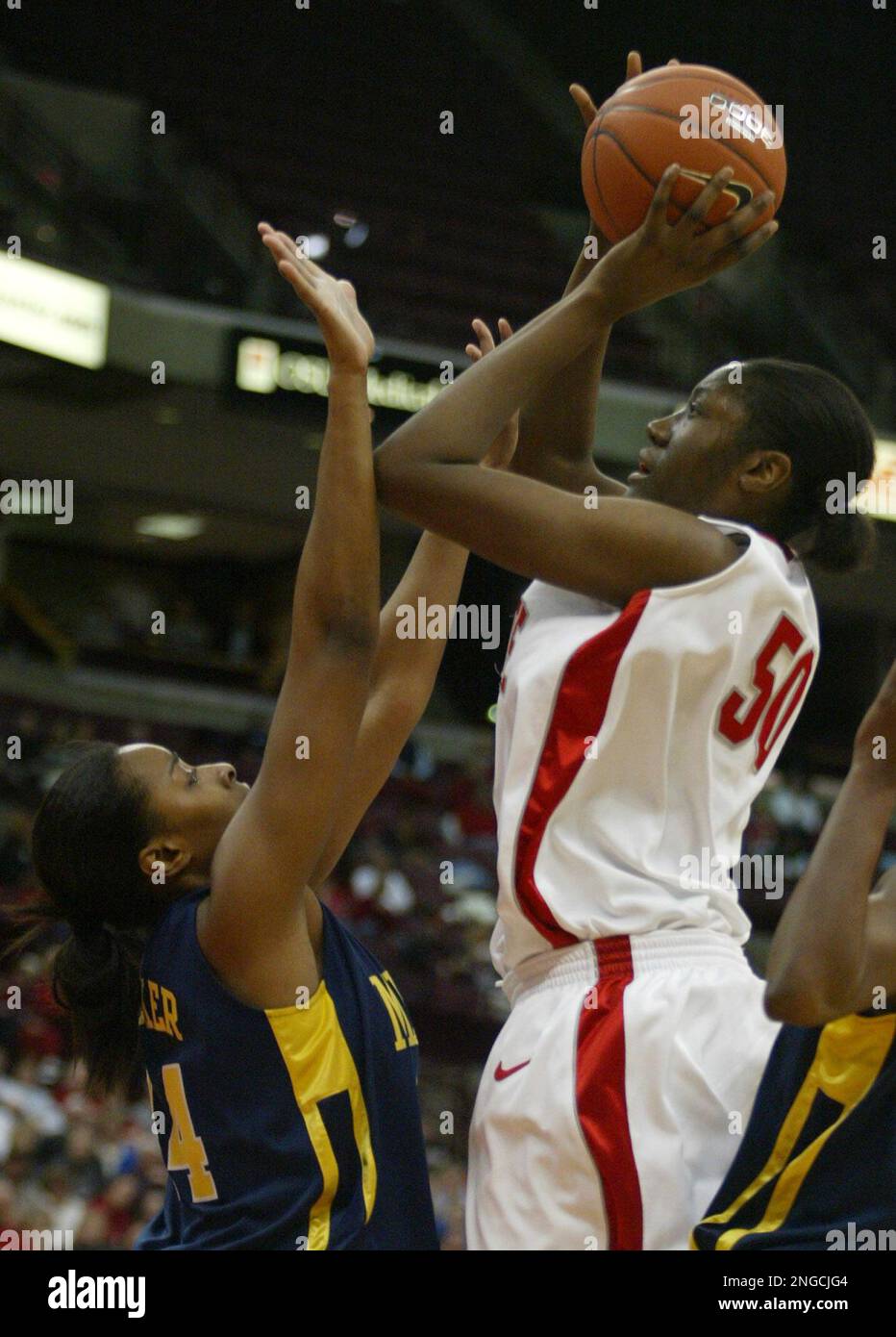 Ohio State's Jessica Davenport (50) takes a shot over Michigan's Ta ...