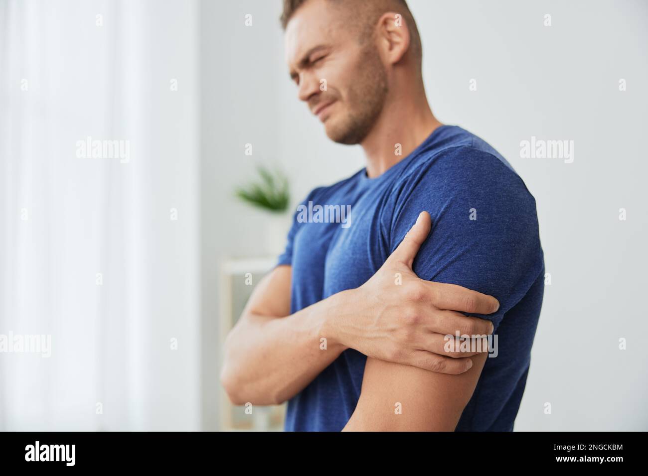 A man has pain in his arm, sprain of muscles and ligaments during ...