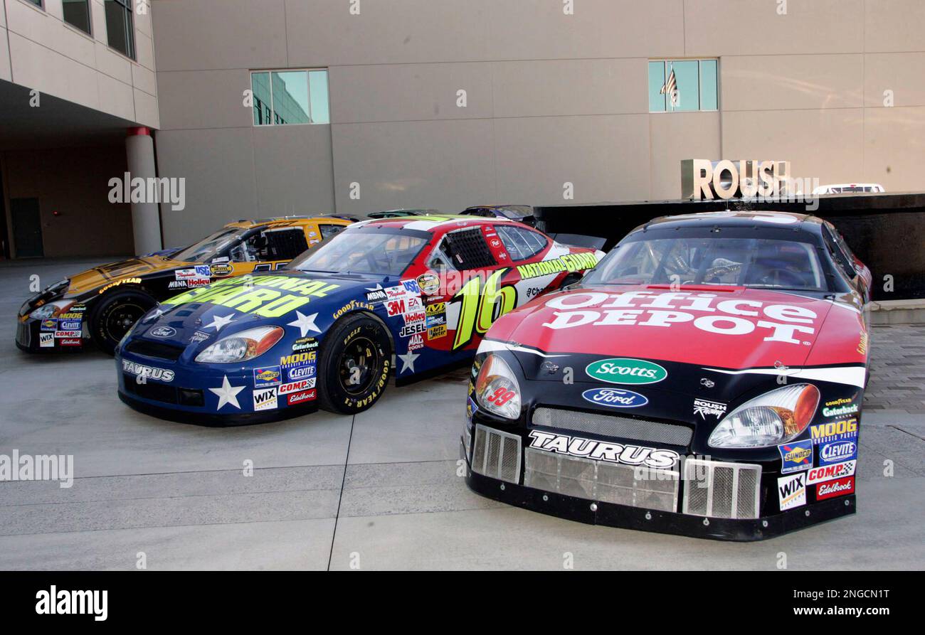 Cars line the entrance to Roush racing's headquarters during the NASCAR ...