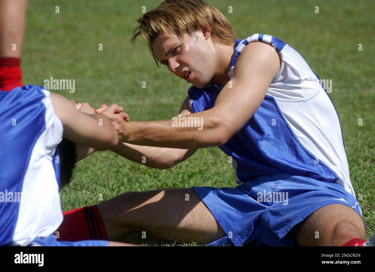 Canada's soccer player Ryan Gyaki, right, stretches during a training ...