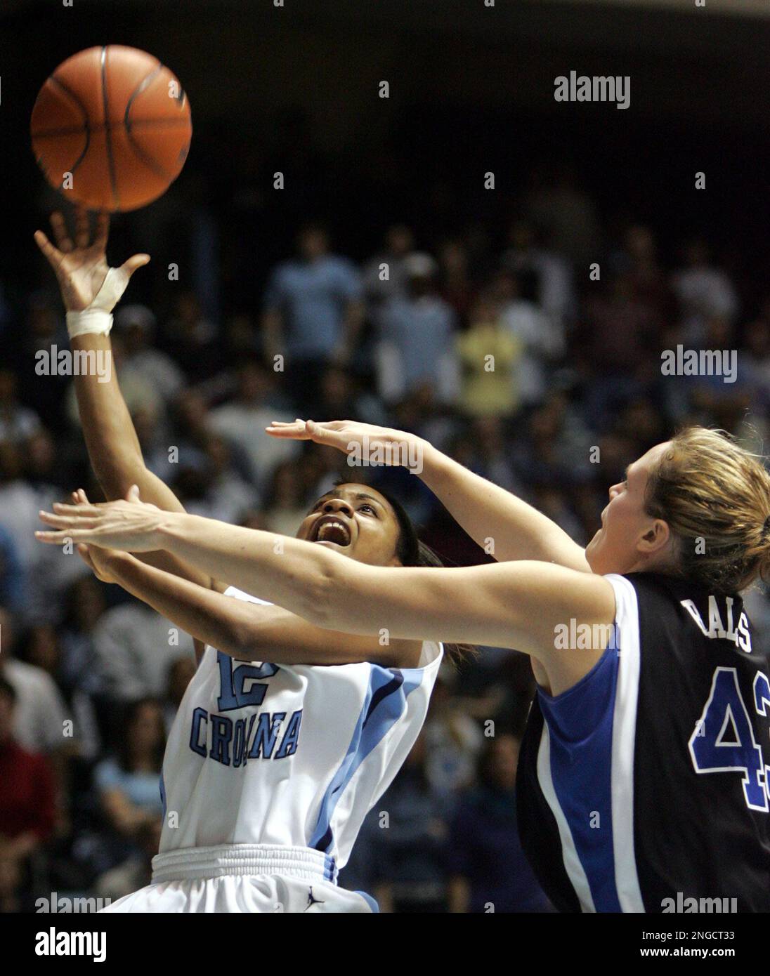 North Carolina's Ivory Latta drives past Duke's Alison Bales during the ...