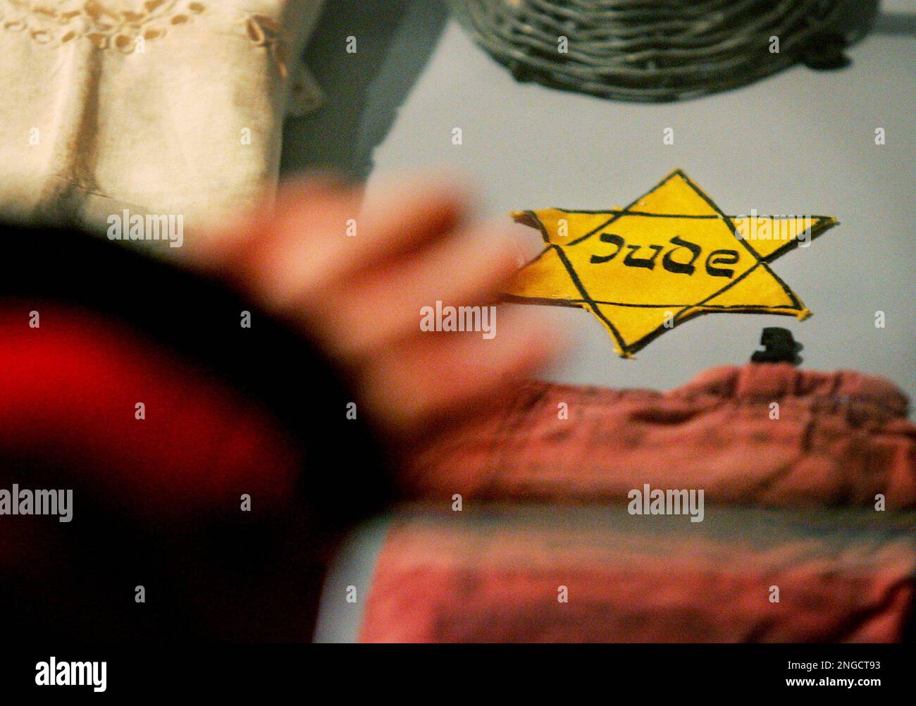 A yellow Star of David Jews were forced to wear by the Nazis, is seen ...