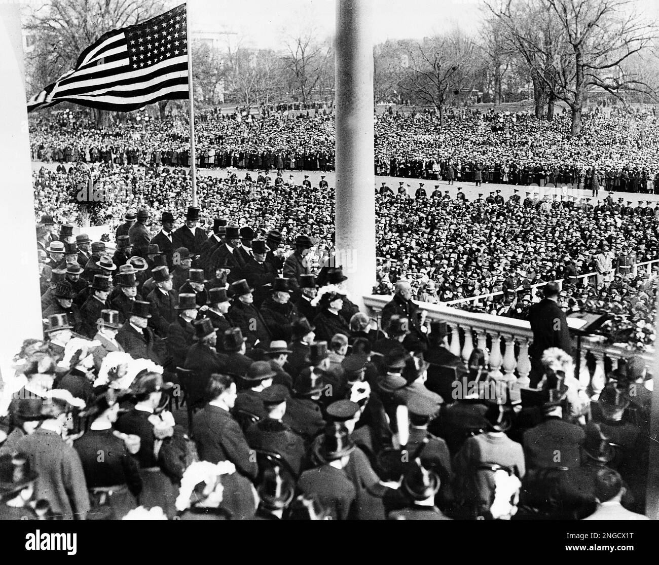 U.S. President Calvin Coolidge, right foreground, delivers his ...