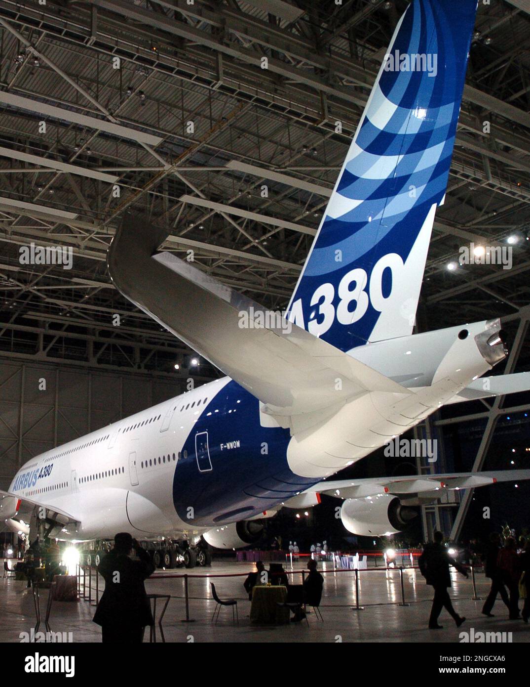 People watch the new Airbus A380 after its unveiling ceremony, near ...