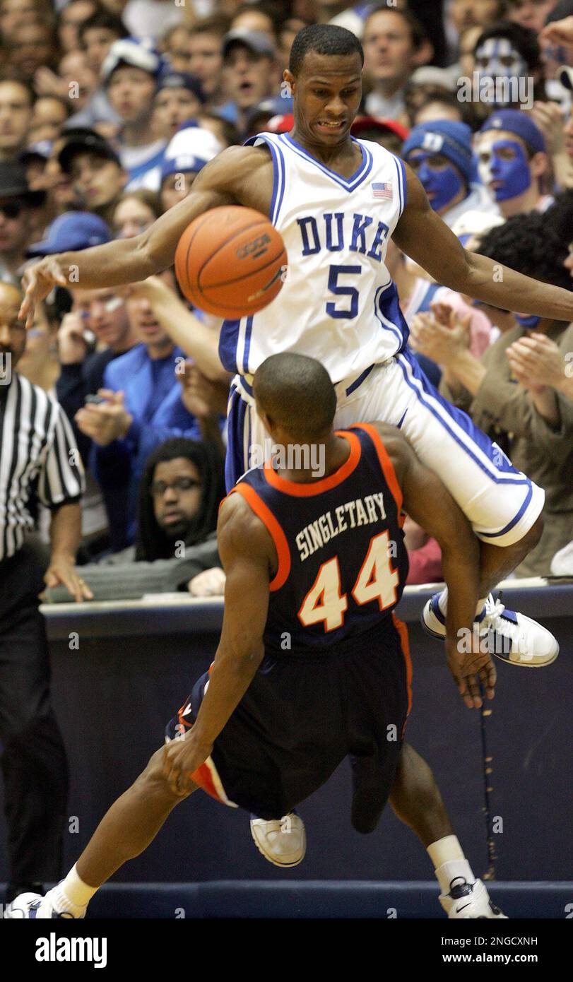 Duke's Daniel Ewing (5) collides with Virginia's Sean Singletary during ...
