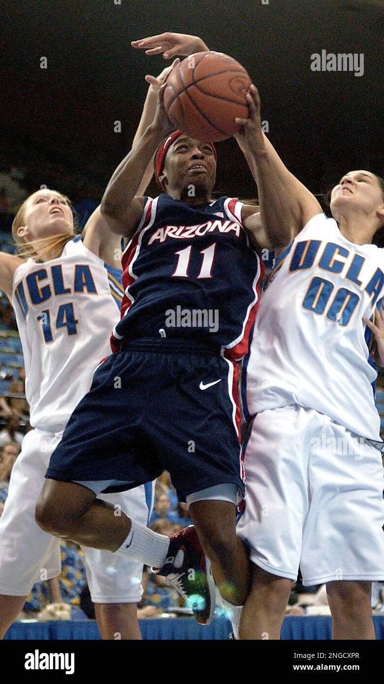 Arizona's Dee-Dee Wheeler, center, shoots between UCLA's Lindsey ...