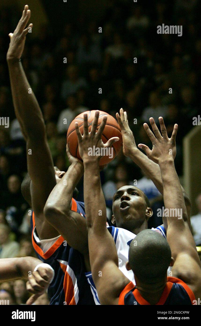 Duke's DeMarcus Nelson tries to shoot past Virginia's Jason Clark, left ...
