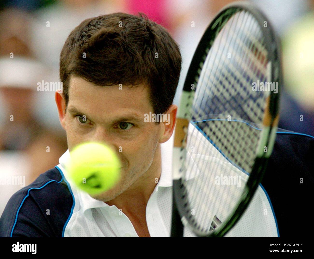 Britain's Tim Henman makes a backhand vollley during his match against ...