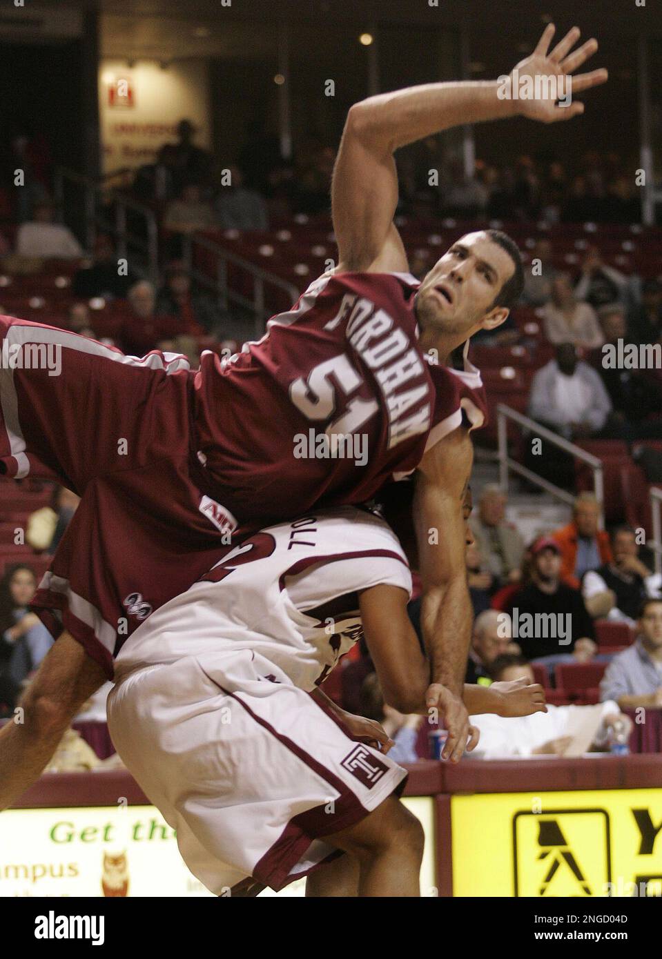 Fordam's Mushon Ya'akosi (51) lands atop Temple's Dashone Kirkendoll ...