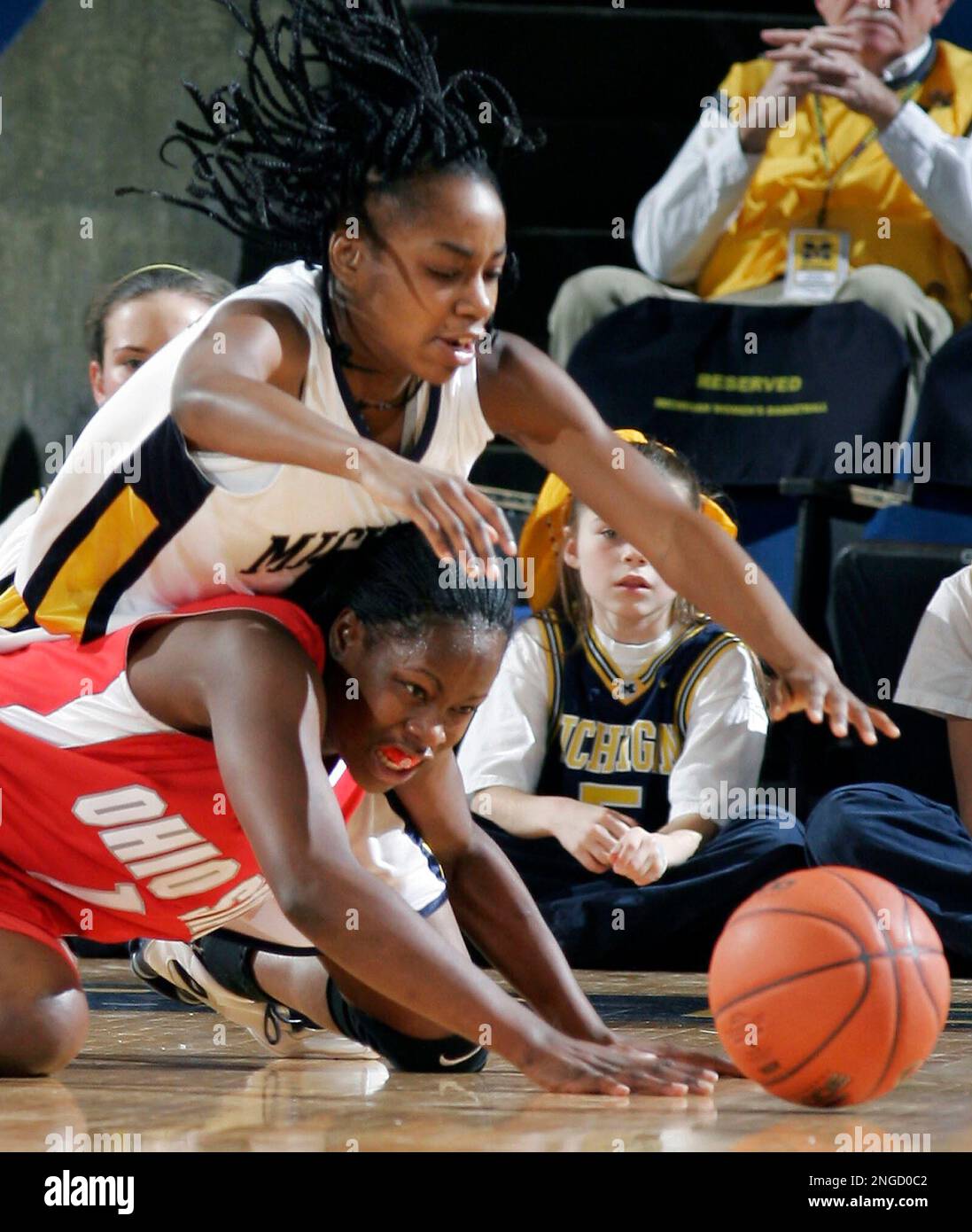Michigan's Jessica Starling, top, and Ohio State's Brandie Hoskins ...