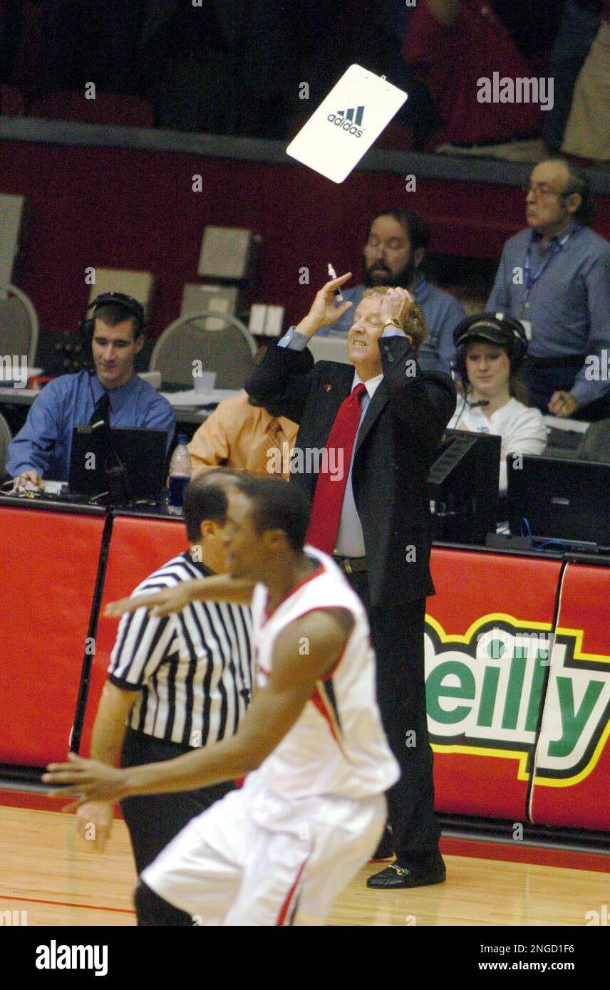 University of Houston coach Tom Penders throws his clipboard up in the ...