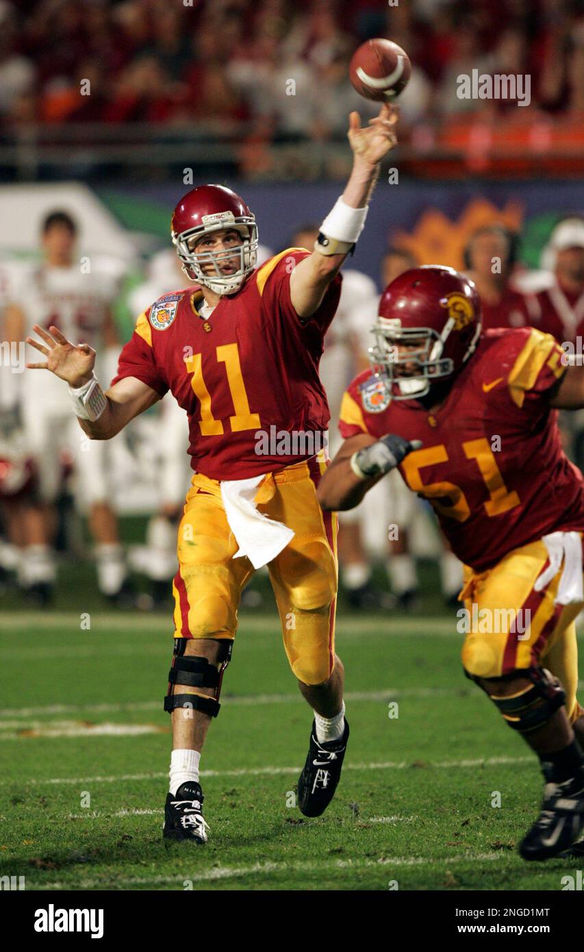 Southern Cal quarterback Matt Leinart (11) throws a pass as teammate ...